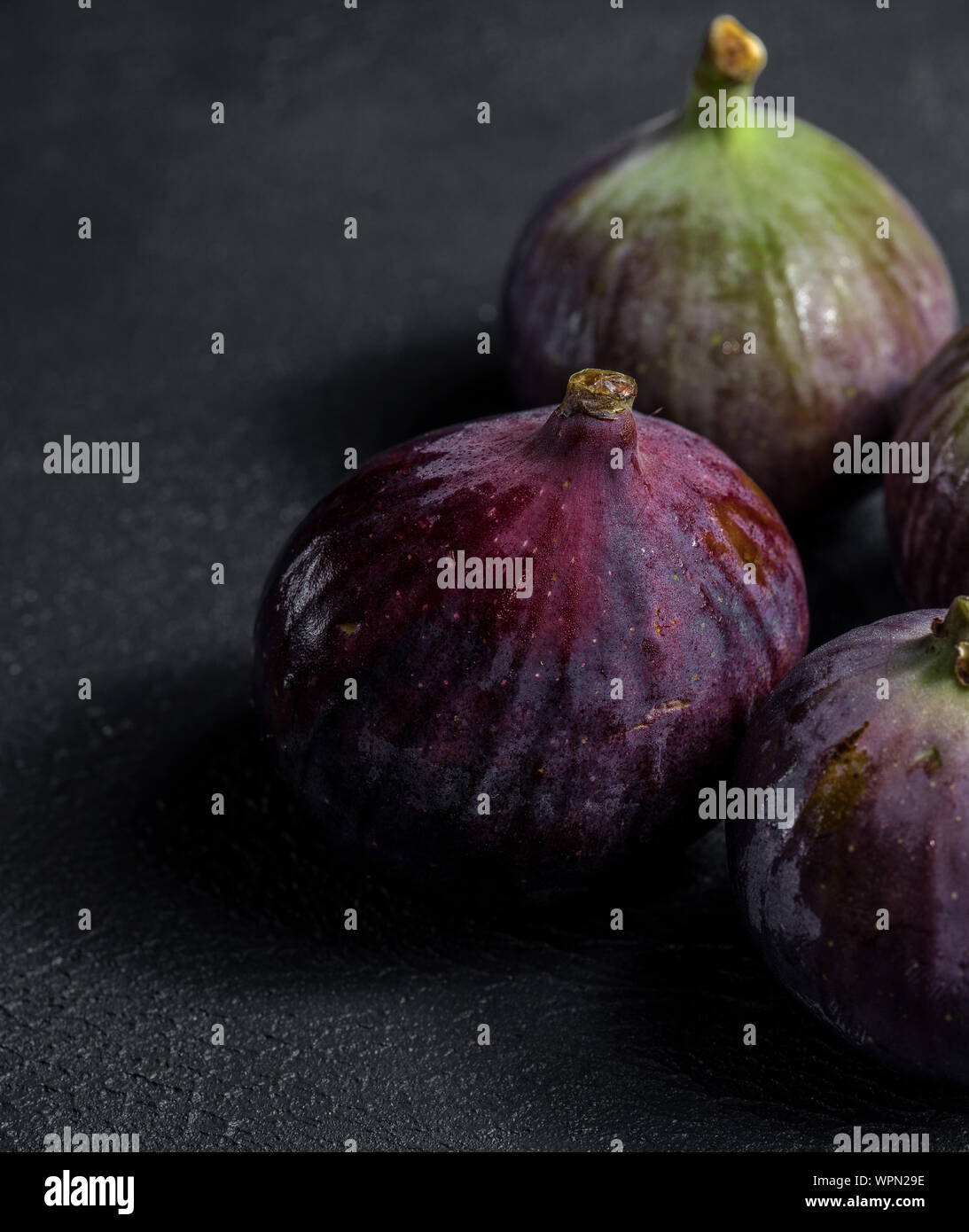 fresh figs close-up photo on dark background. dark moody photo Stock ...