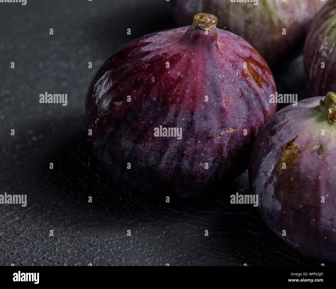 fresh figs close-up photo on dark background. dark moody photo Stock ...