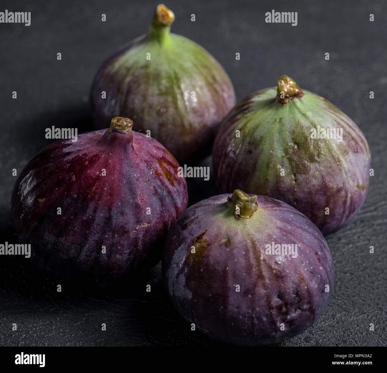 fresh figs close-up photo on dark background. dark moody photo Stock ...