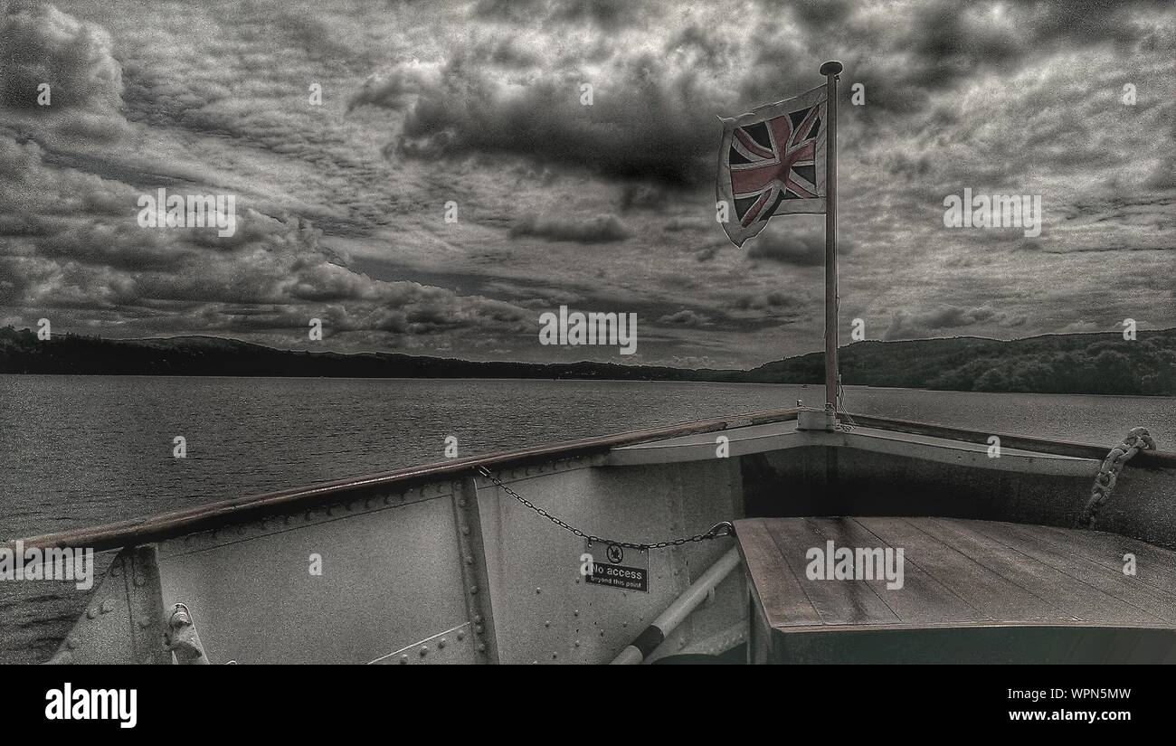 British Flag Waving On Boat At River Stock Photo - Alamy