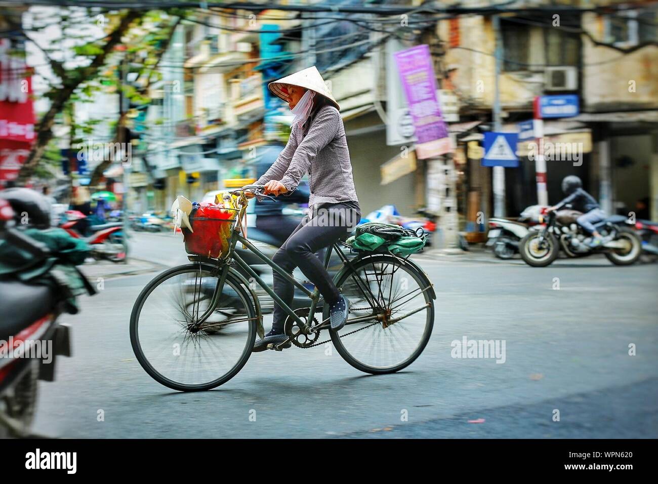 Woman riding bicycle on city hi-res stock photography and images - Alamy