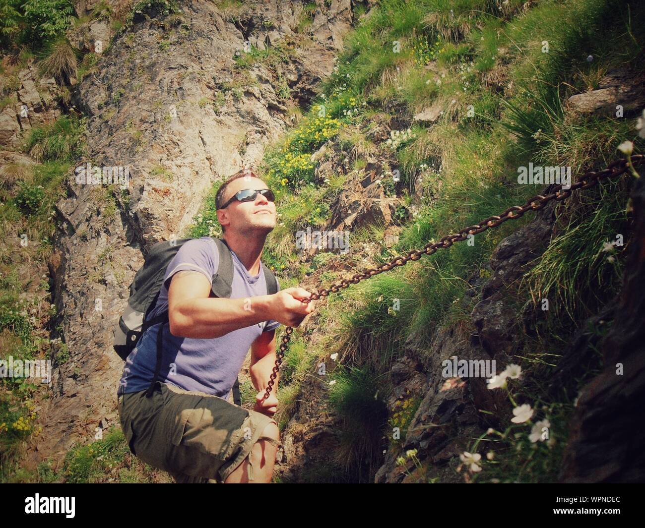 Three men climbing mountain hi-res stock photography and images - Alamy