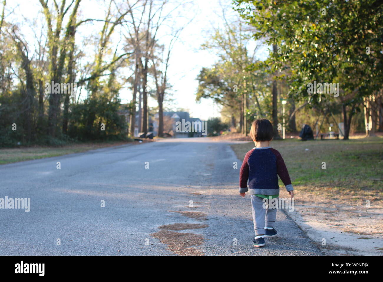 Boy rear view walking road hi-res stock photography and images - Alamy