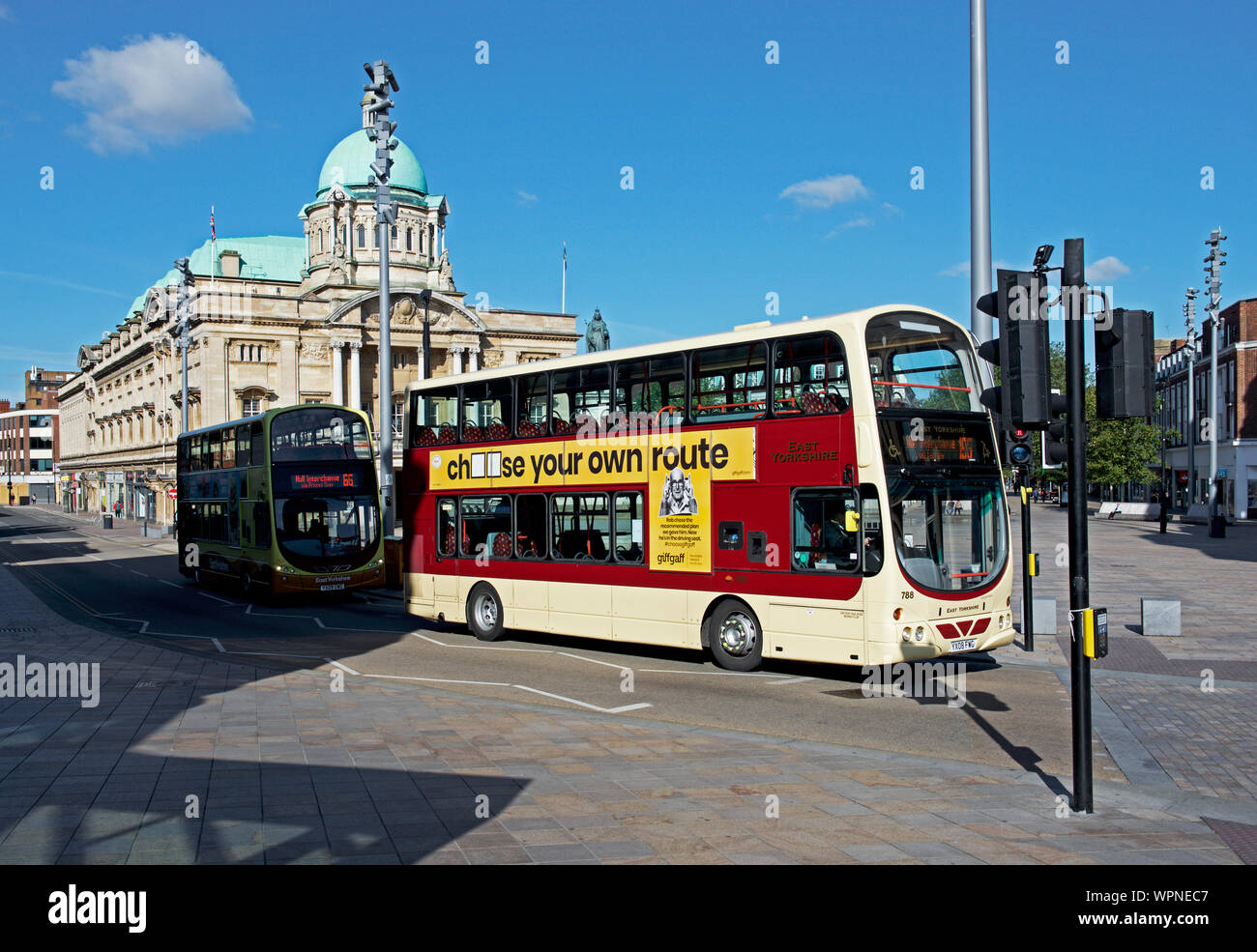 Buses passing City Hall and Queen Victoria Square, in the centre of ...
