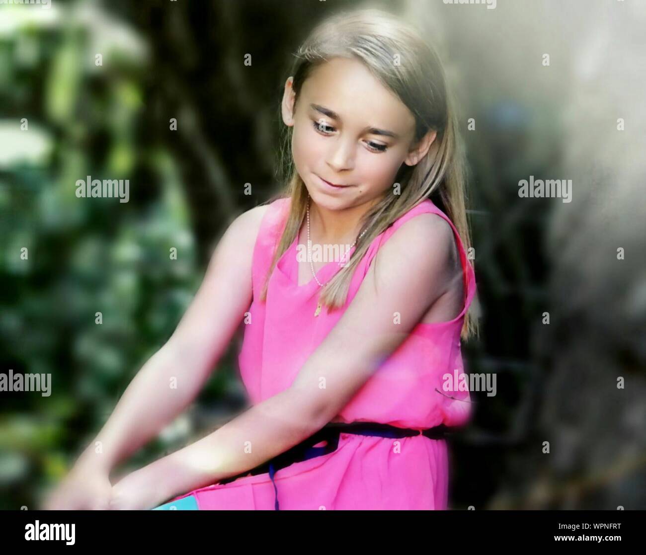Girl wearing pink dress hi-res stock photography and images - Alamy