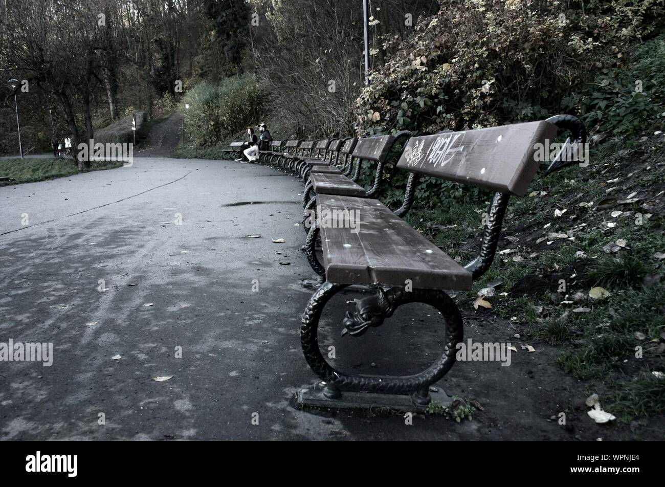 Two men sitting on benches hi-res stock photography and images - Alamy