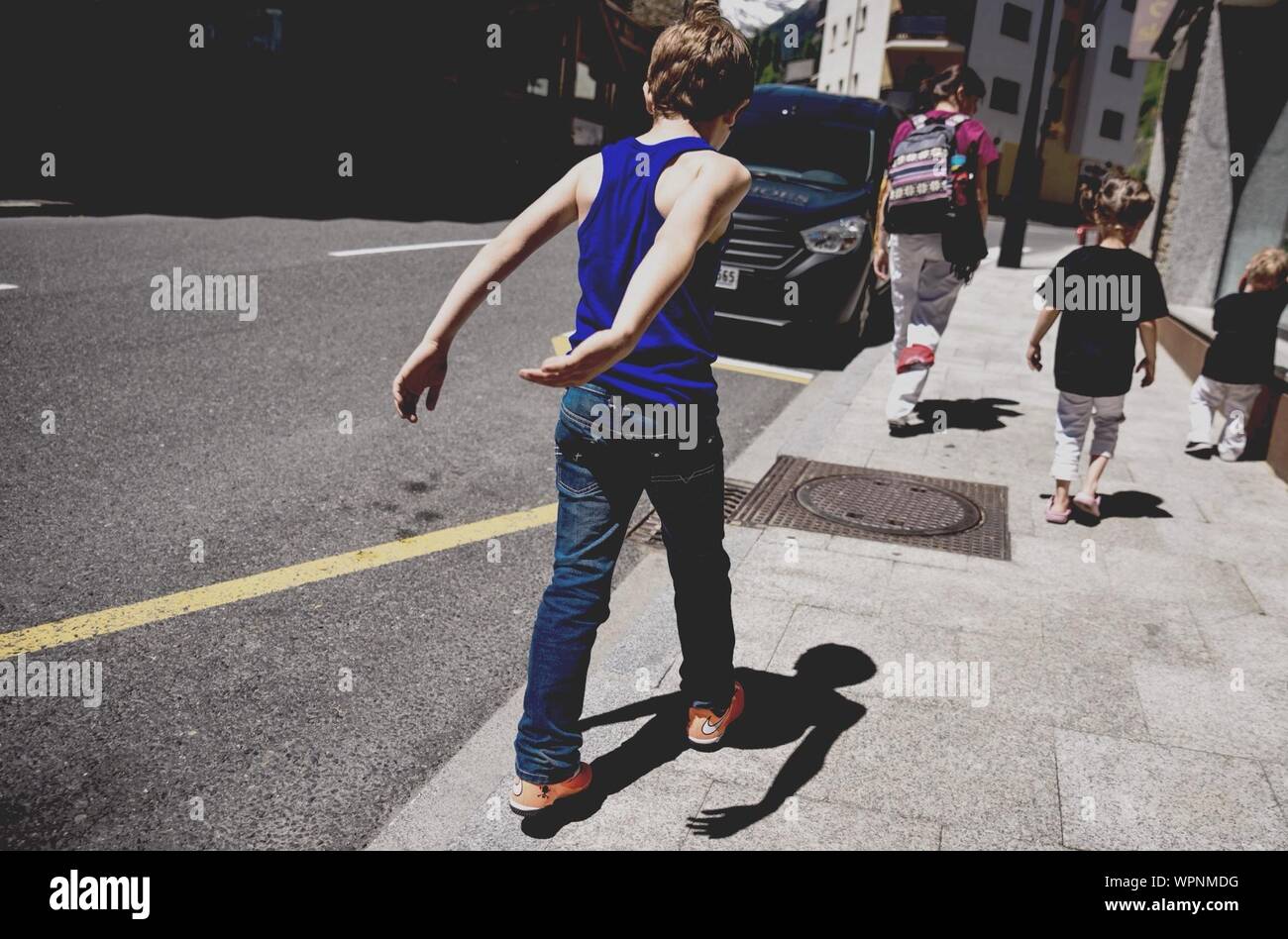 Children walking on street hi-res stock photography and images - Alamy