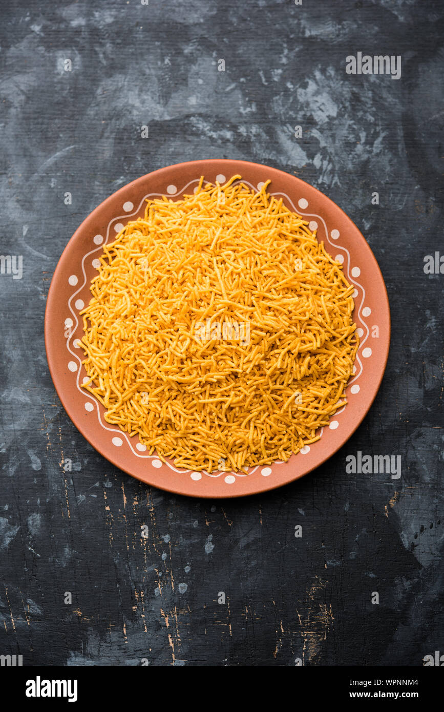 Aloo Bhujiya or Potato Bhujia also known as Namkeen sev. Popular Bikaneri recipe served in a ...