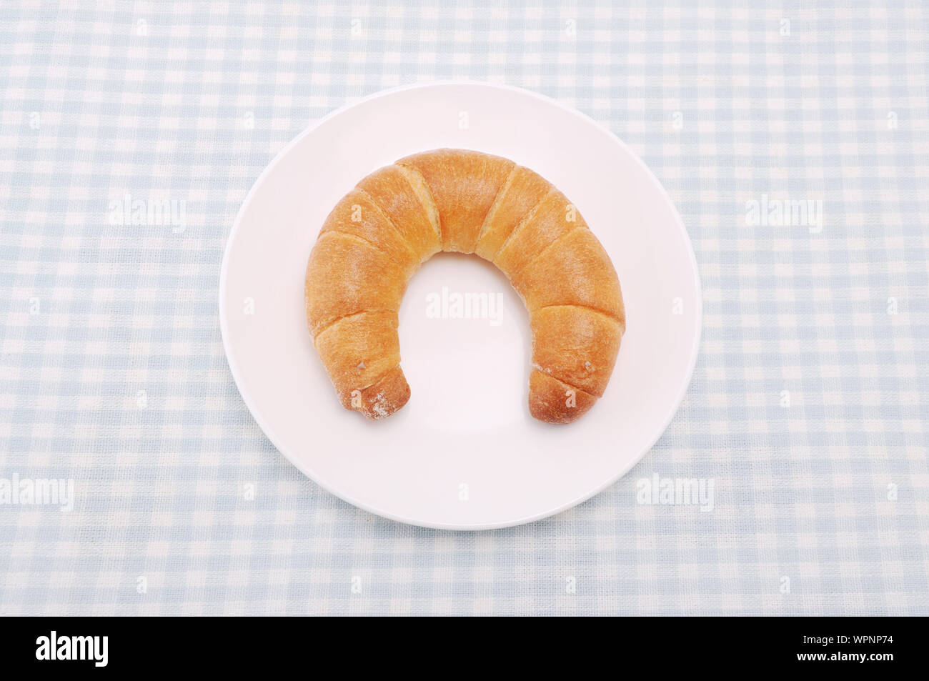crescent roll croissant french bread isolated on table Stock Photo - Alamy