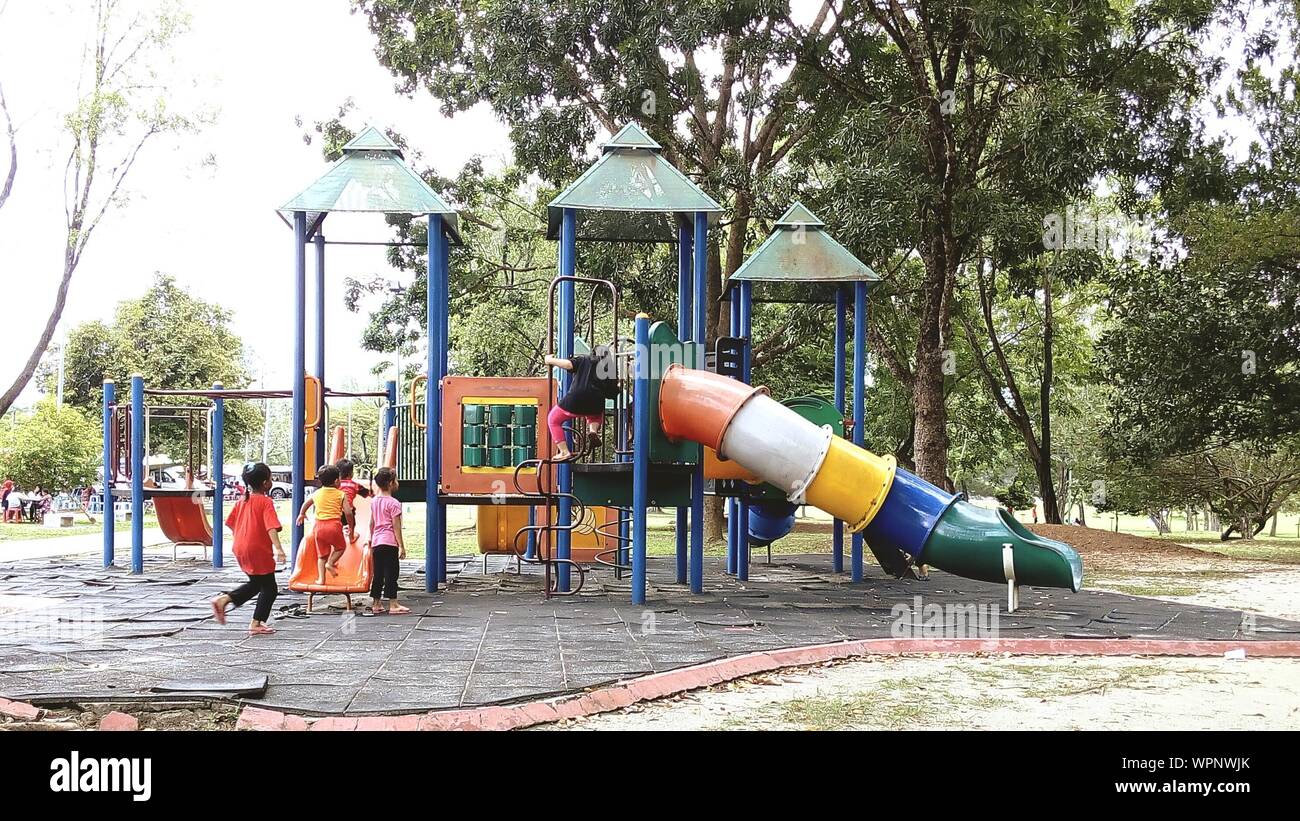 Children playing on play park hi-res stock photography and images - Alamy