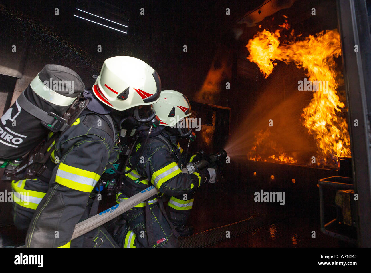 Pirna, Germany. 05th Sep, 2019. Two firefighters practice with a flash ...
