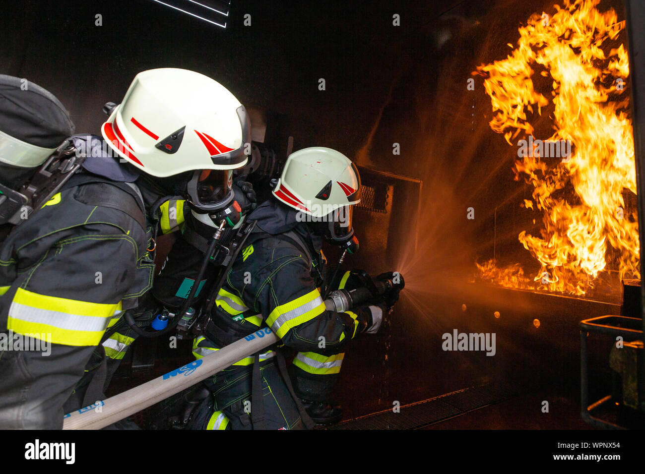 Pirna, Germany. 05th Sep, 2019. Two firefighters practice with a flash ...