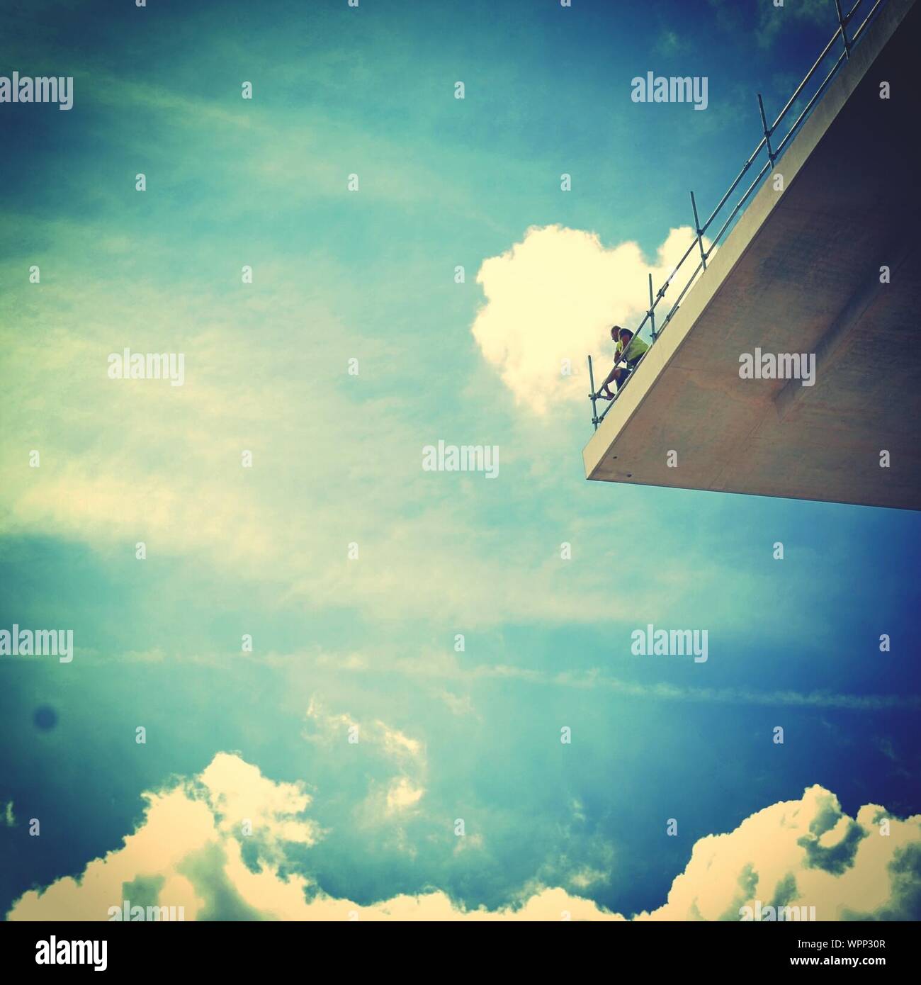 Man standing on balcony hi-res stock photography and images - Alamy