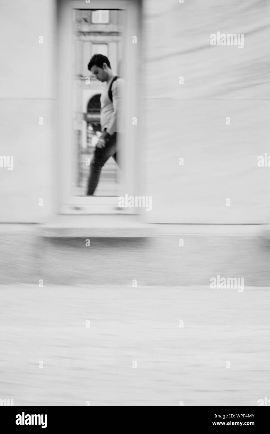 Mirror reflection on people walking hi-res stock photography and images ...