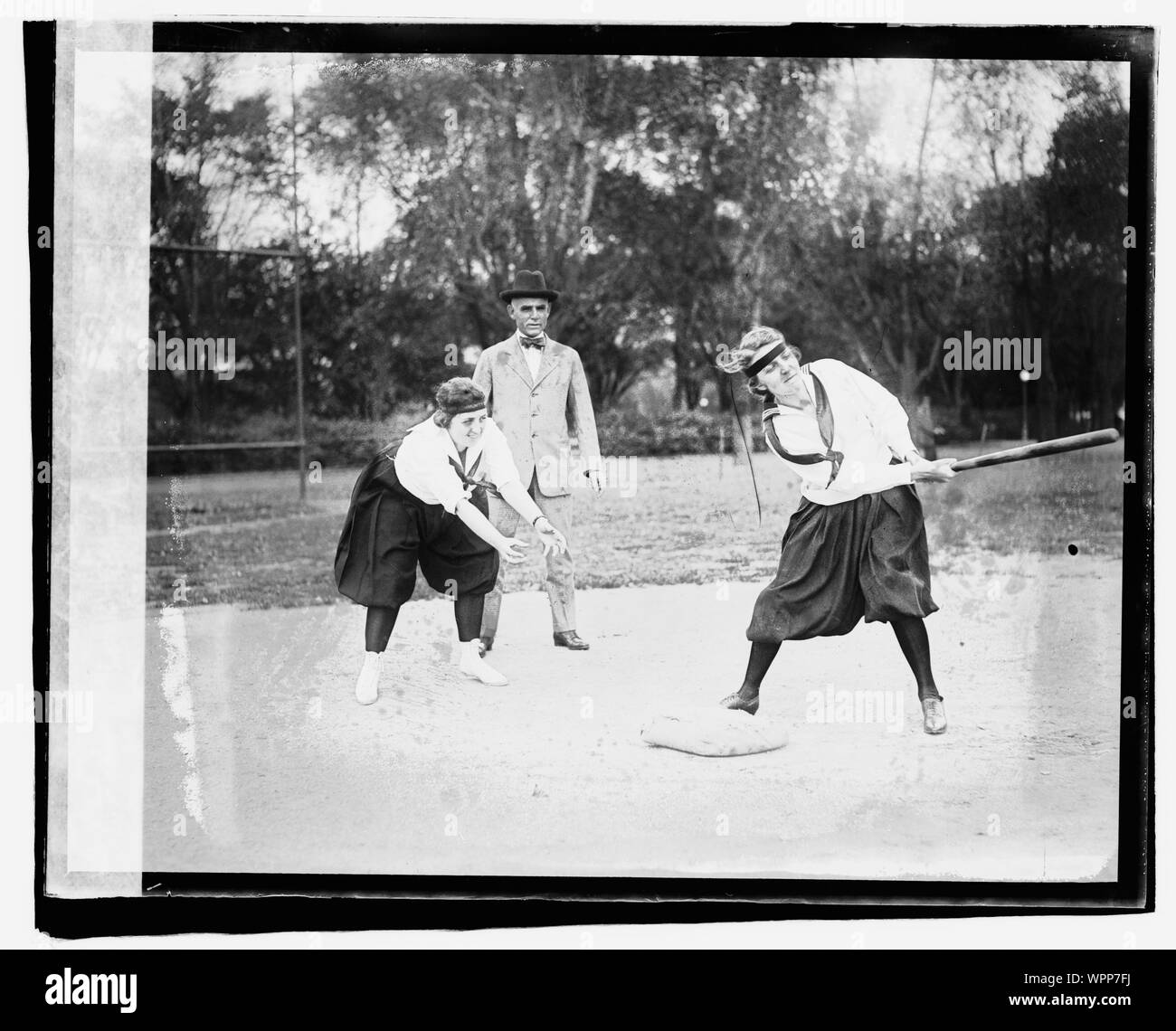 Lucile Boyd catching; Mary Cook at bat Stock Photo - Alamy