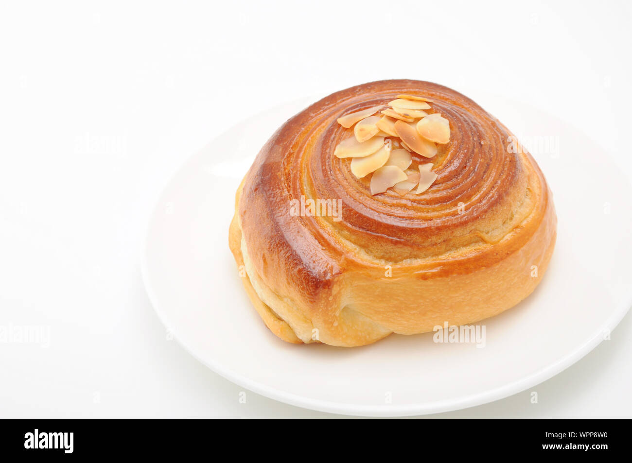 almond round bread closeup isolated on white background Stock Photo - Alamy