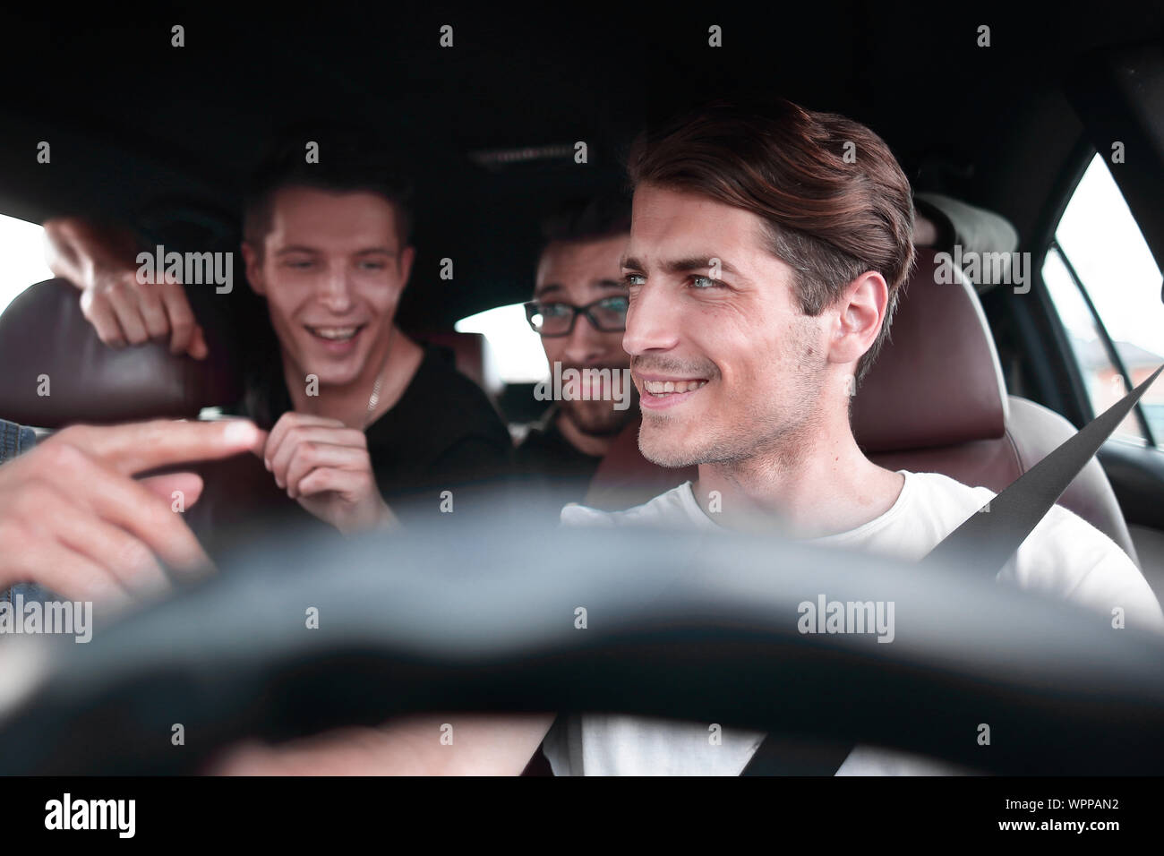customers smiling while talking to about their driver Stock Photo - Alamy