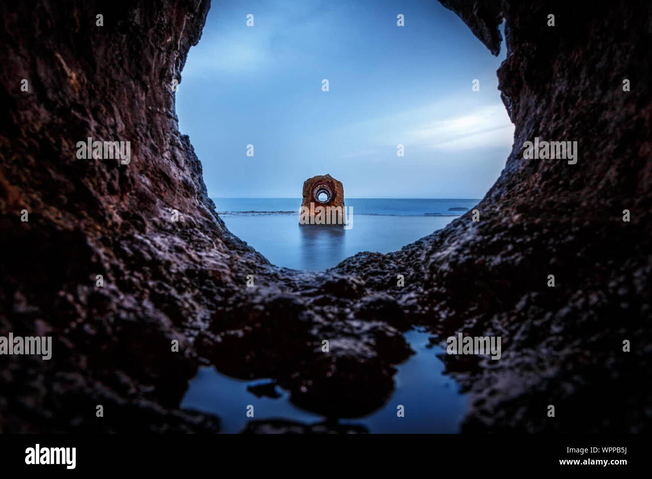 Cliff with hole hi-res stock photography and images - Alamy