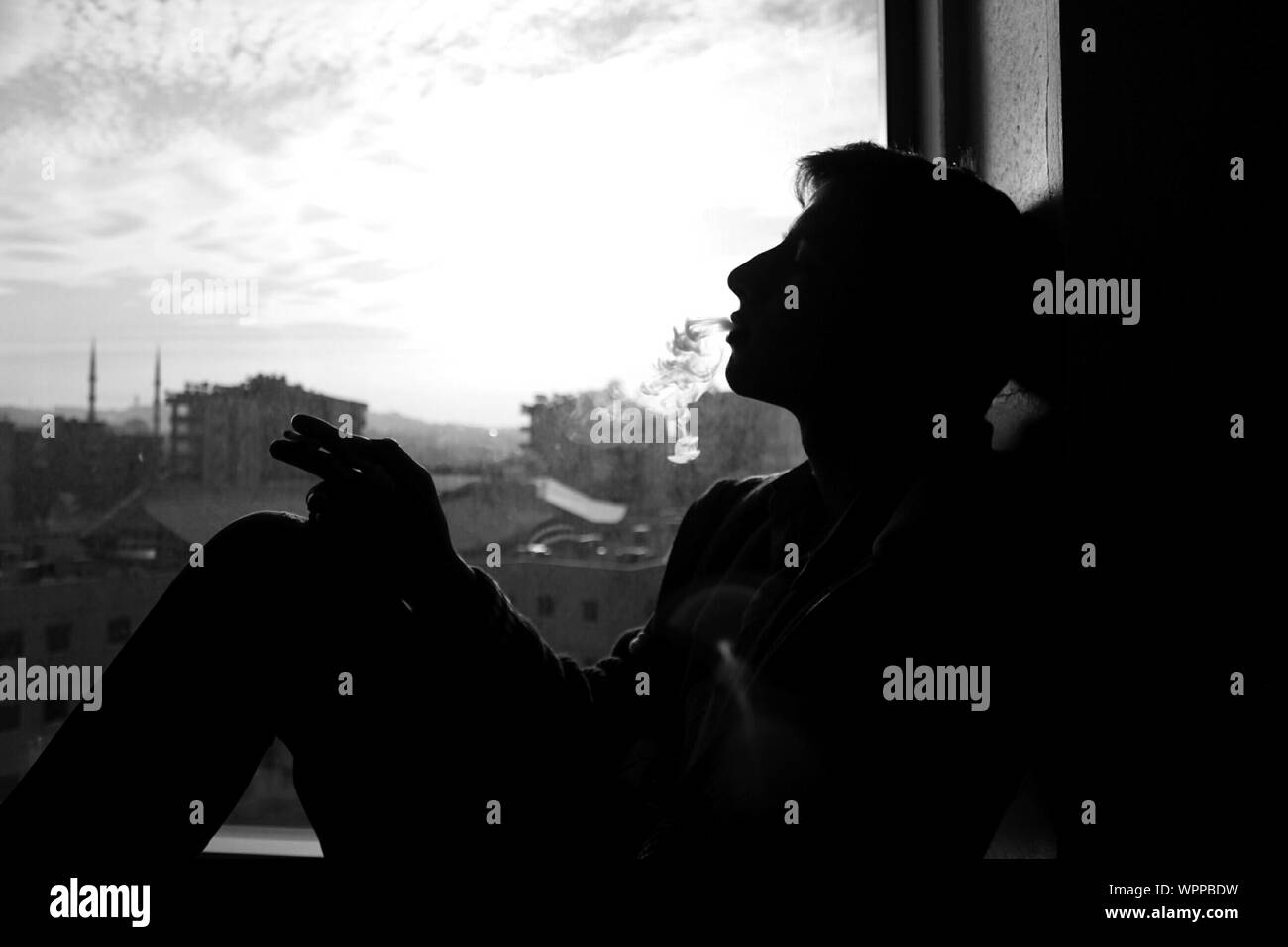 Smoking man at the window Black and White Stock Photos & Images - Alamy