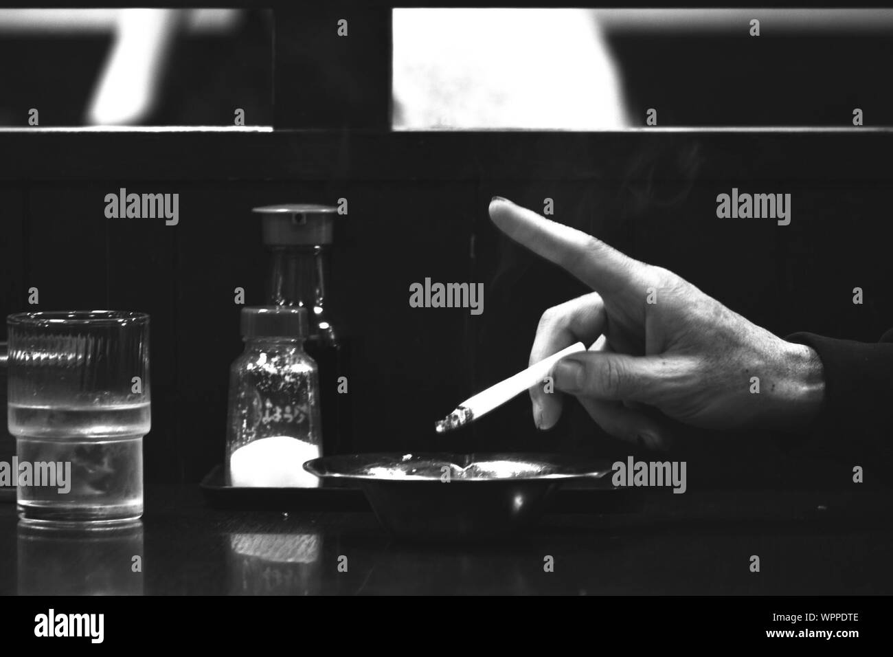 Ashing cigarette hi-res stock photography and images - Alamy