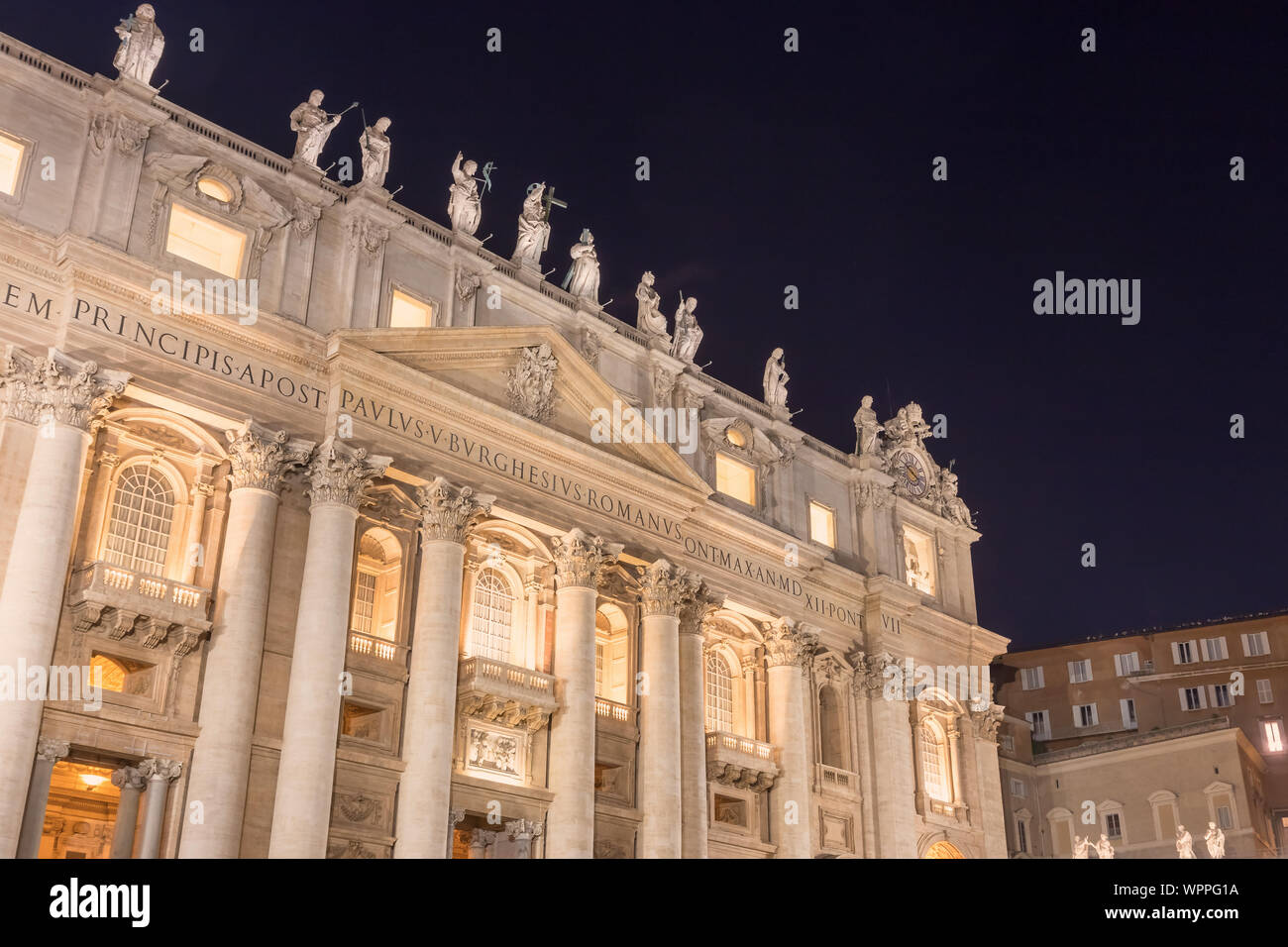 Night shot of St. Peter's Basilica with pope's balcony in Vatican City ...