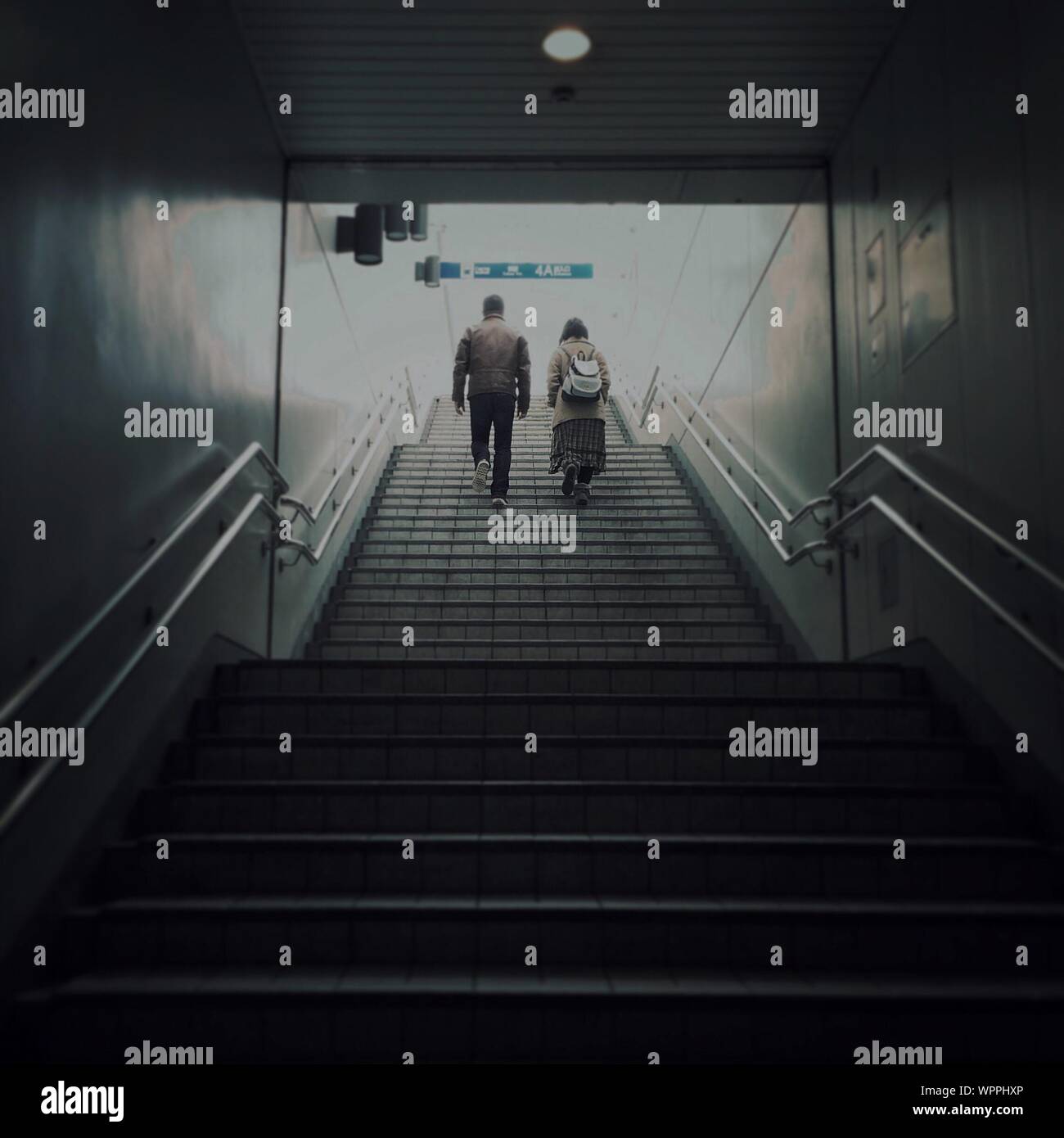 Two people walking up stairs hi-res stock photography and images - Alamy