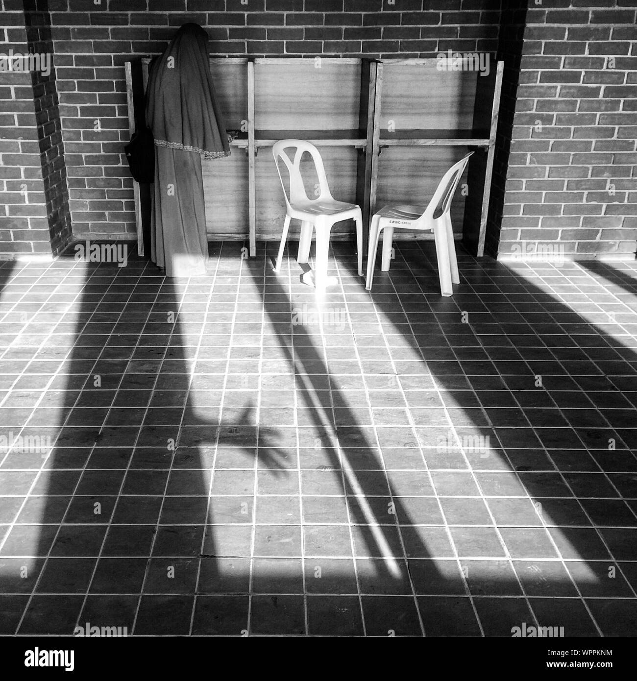 Shadow on chair Black and White Stock Photos & Images - Alamy