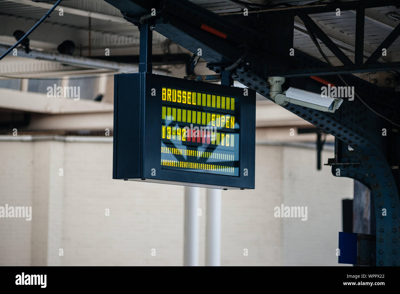Side view of Electronic arrival departure board with city name and ...
