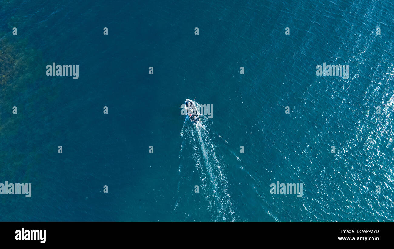 Sea surface with boat aerial view Stock Photo - Alamy