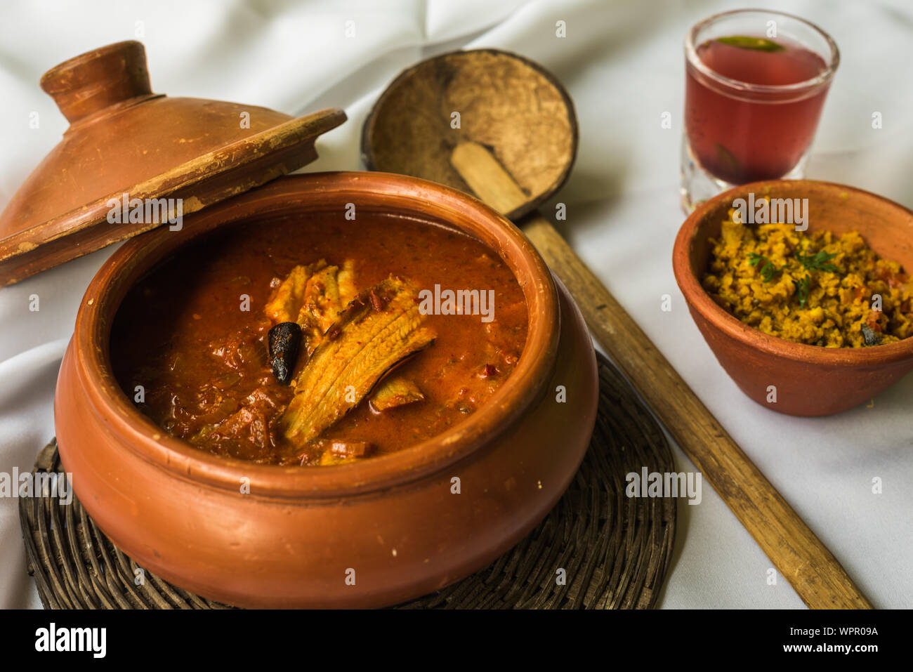 Goan seafood curry served traditionally with kokum juice and small ...