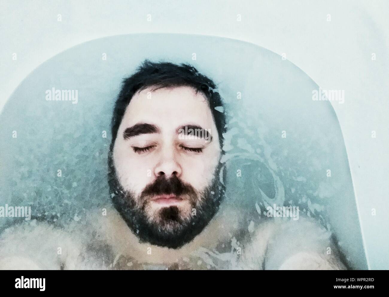 Man in bath hi-res stock photography and images - Alamy