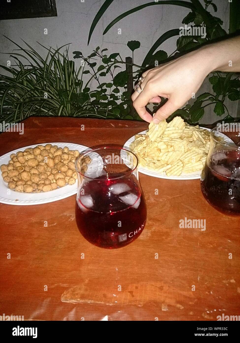 Hand holding chips hi-res stock photography and images - Alamy