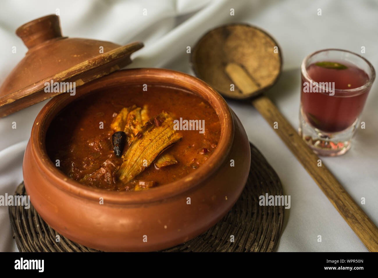 Goan seafood curry served traditionally with kokum juice and small ...