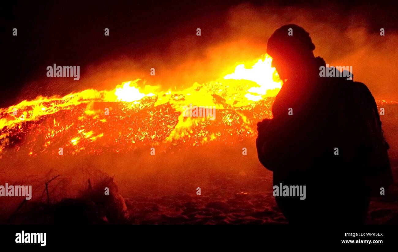 Silhouette man front fire hi-res stock photography and images - Alamy
