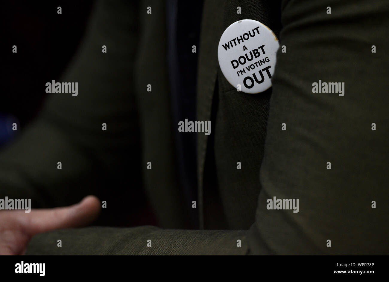 A badge worn by a protester near to the Houses of Parliament in London ...