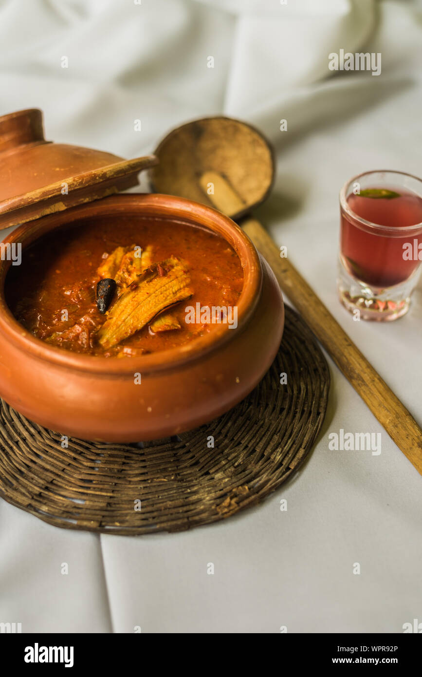 Goan seafood curry served traditionally with kokum juice and small ...