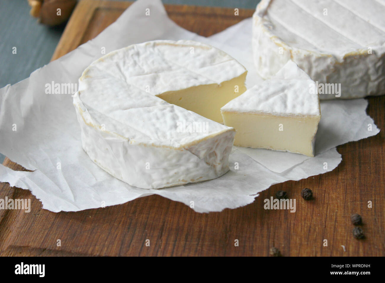 Camembert cheese. Farm products, rustic cheese. Copy space Stock Photo ...