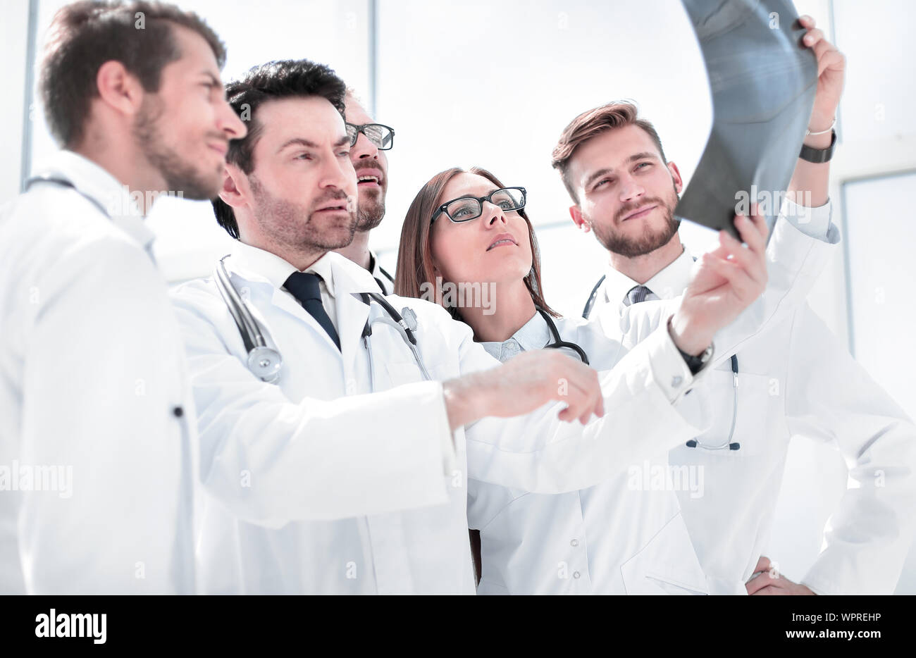 group of doctors discussing the x-ray. the concept of teamwork Stock ...