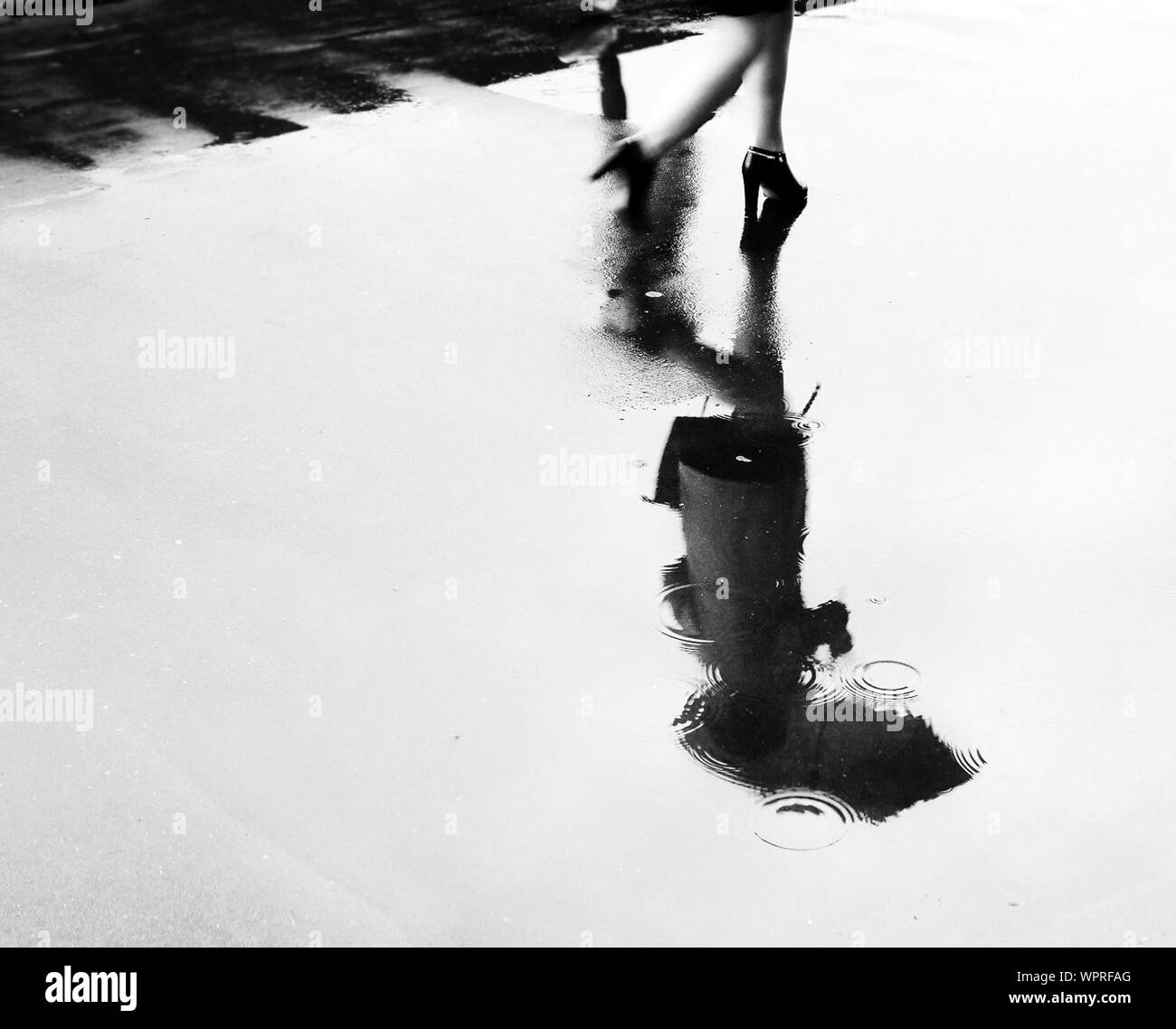 Reflection woman puddle city hi-res stock photography and images - Alamy