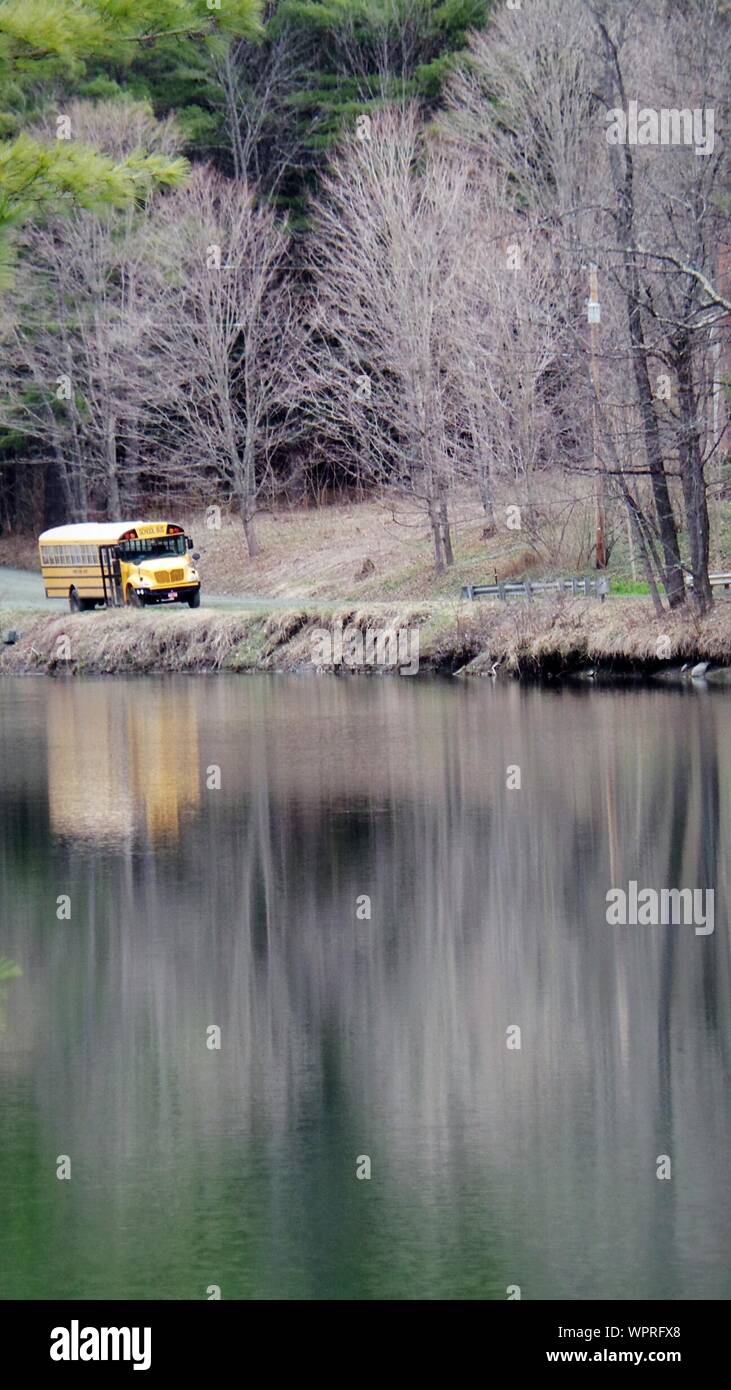 School Bus Passing By River Stock Photo - Alamy