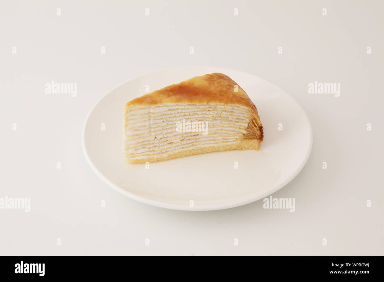 Mille crepe french cake on a plate isolated on white background Stock ...