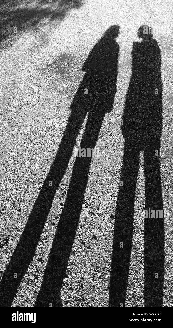 Two women and their shadow Black and White Stock Photos & Images - Alamy