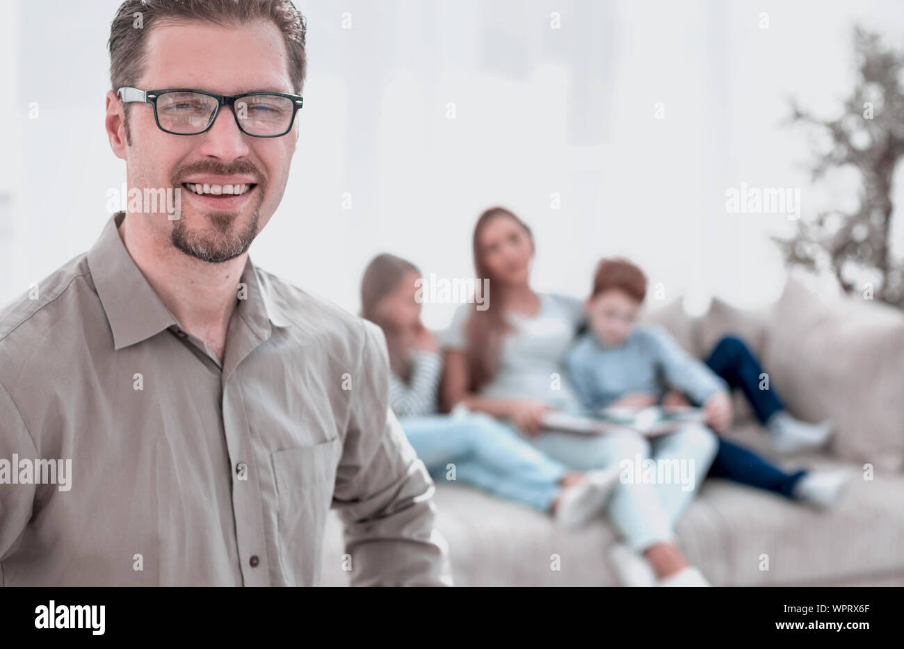 successful man standing in his living room.photo with copy space Stock ...