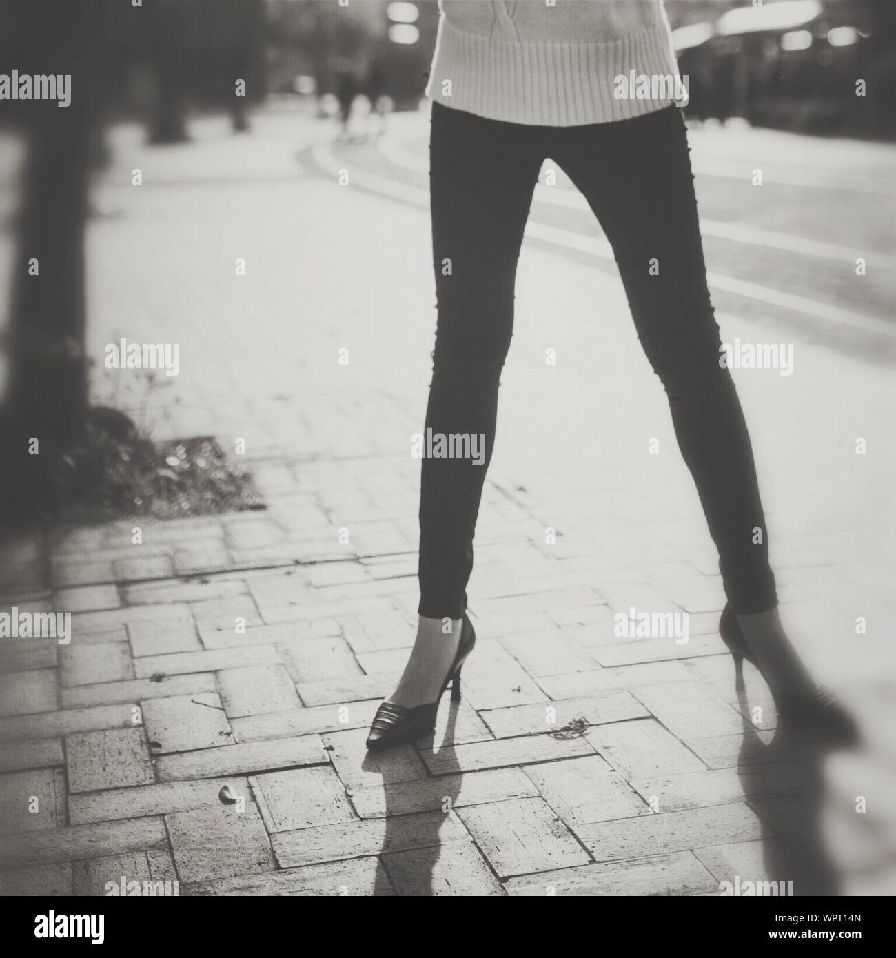 Woman standing legs apart high heels hi-res stock photography and ...