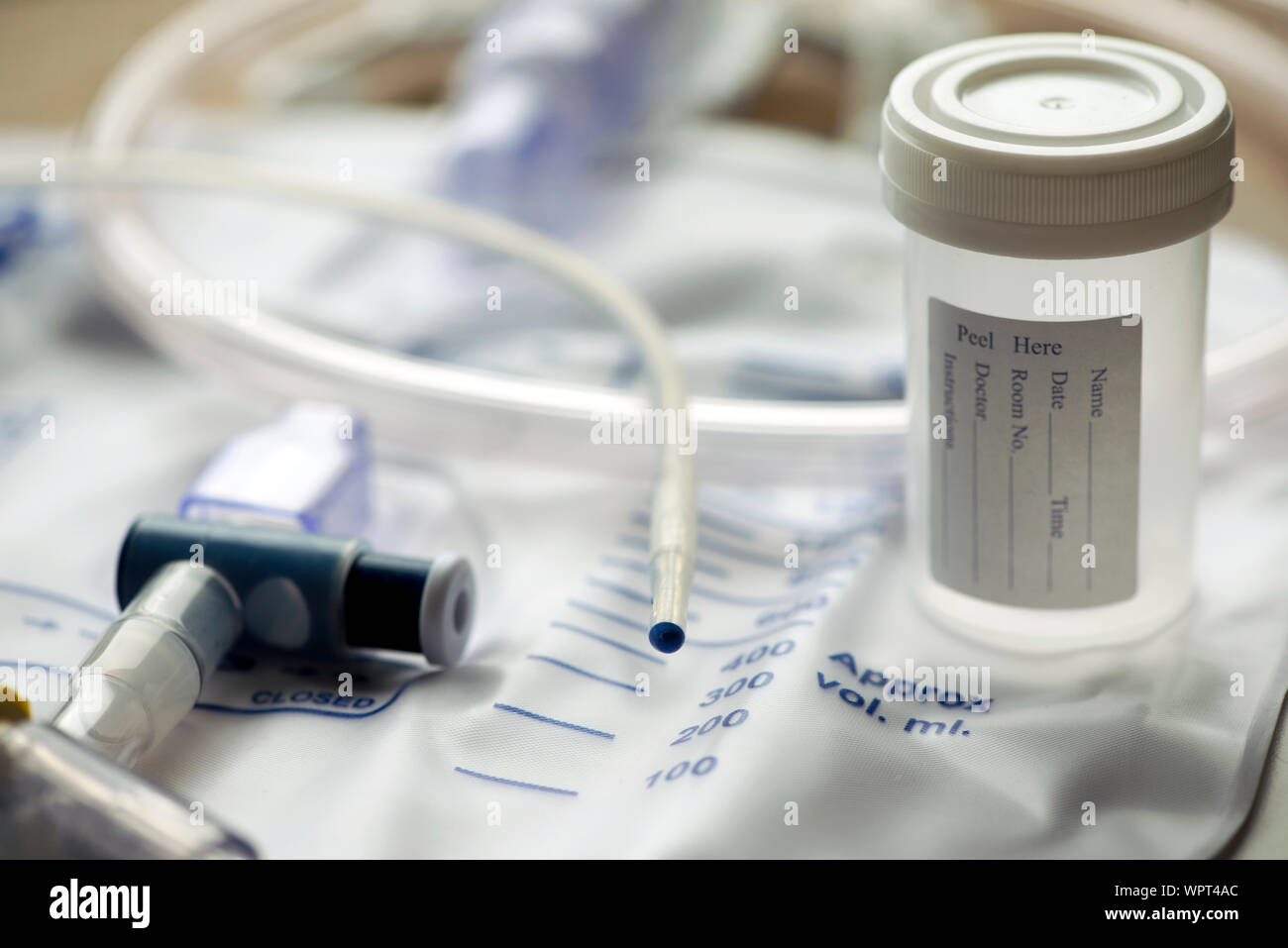 Urinary Catheter with drainage bag and sample cup Stock Photo - Alamy