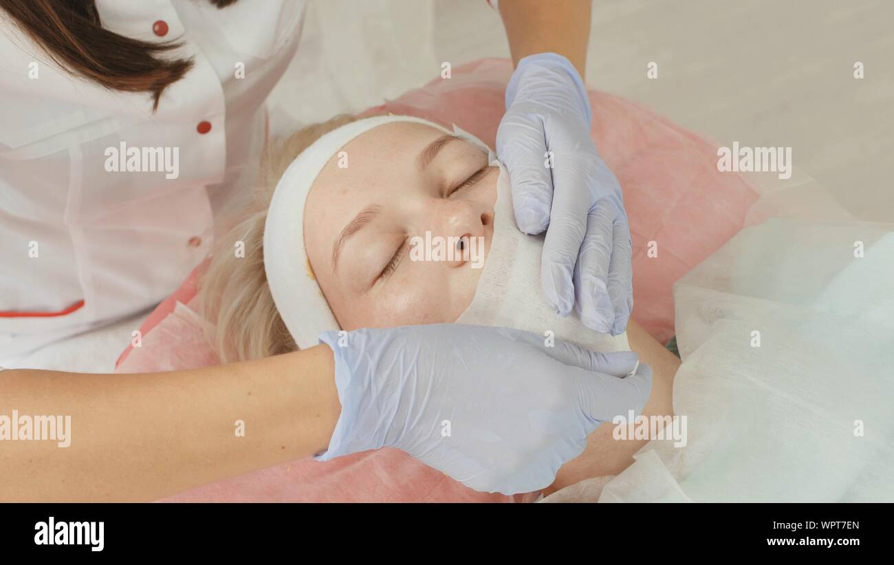 Wipe the face with a tissue. Cleaning and care of the face Stock Photo ...