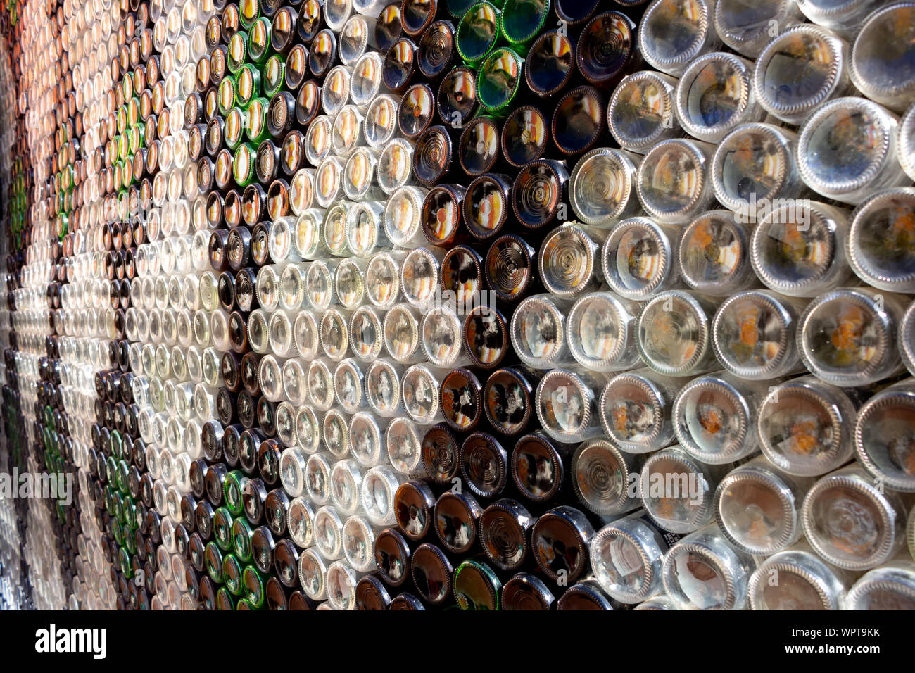 A view of a wall of glass beer bottles, as a background Stock Photo - Alamy