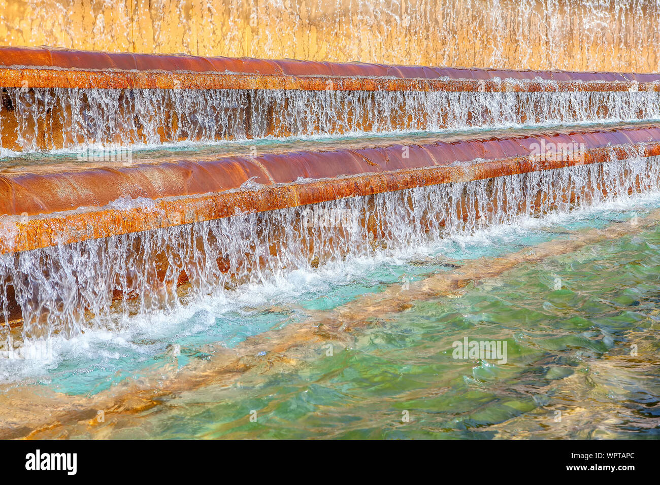Water falls down in fountain cascades Stock Photo - Alamy