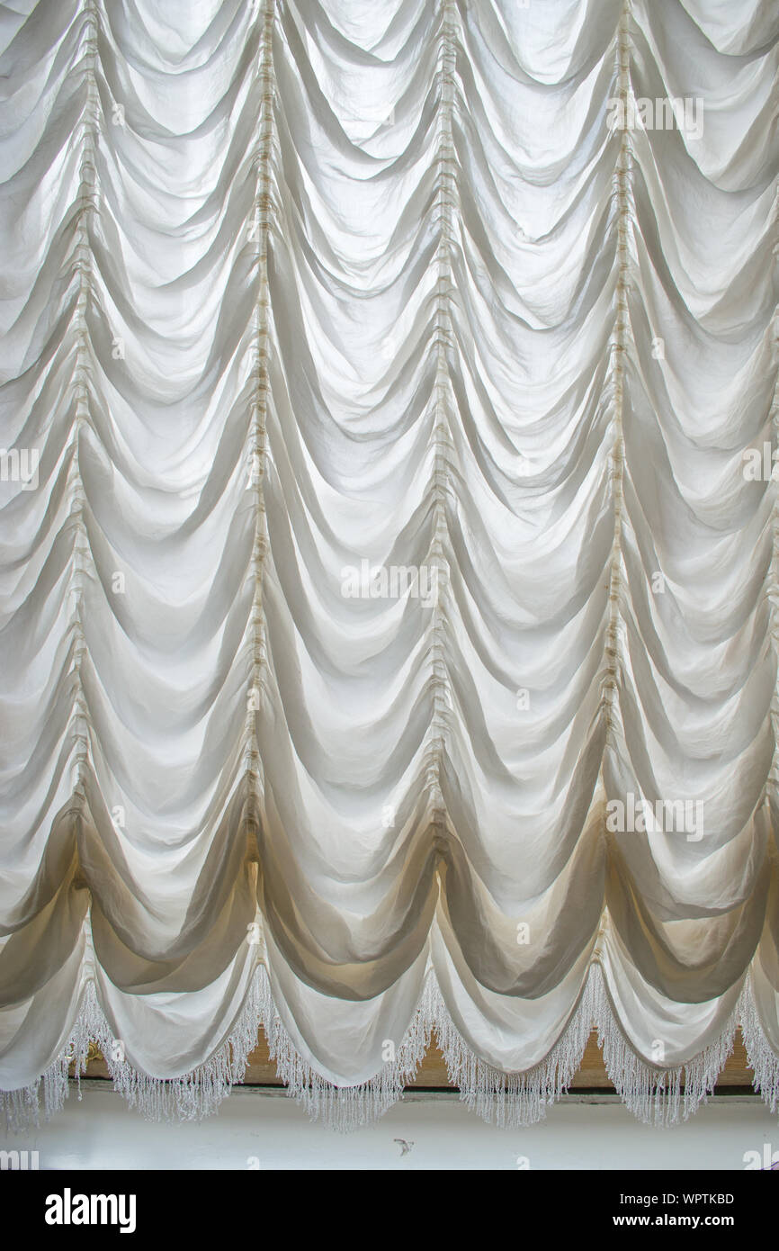 Elegant white interior curtain in front of a window Stock Photo - Alamy