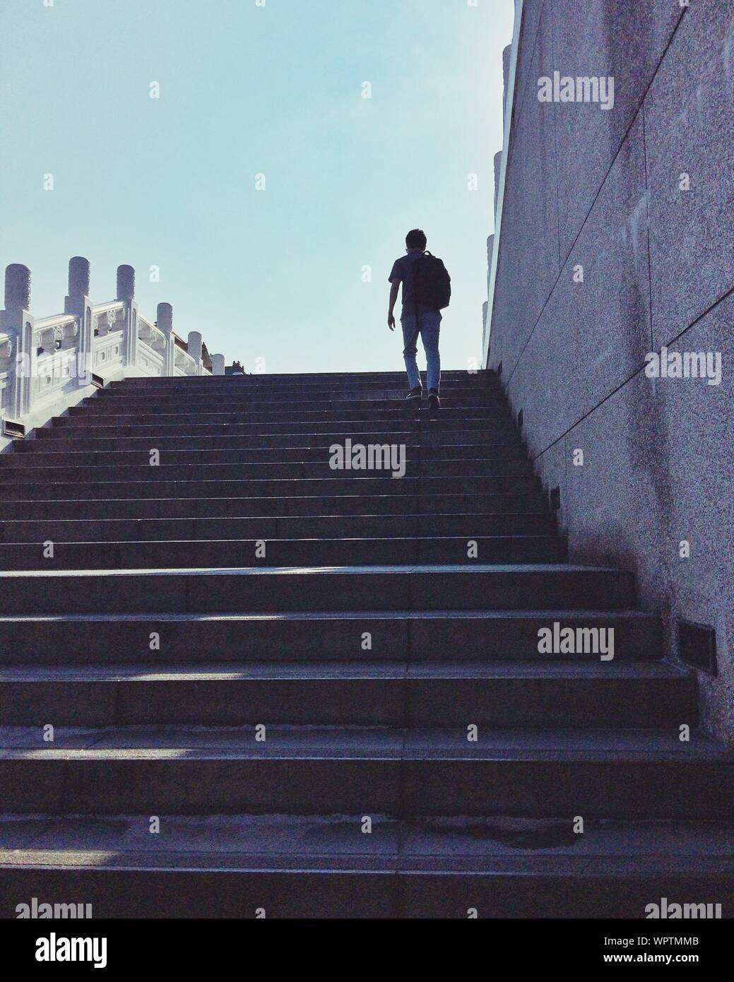 Man walking up steps hi-res stock photography and images - Alamy